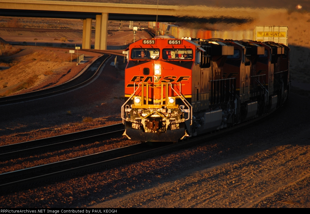 BNSF 6651 leads a Hot Z-Train westbound as the sun sets on her Brand New BNSF Swoosh Logo as the ...